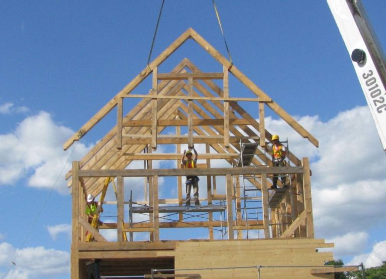 Flying in the last gable - Arlington Timber Frames